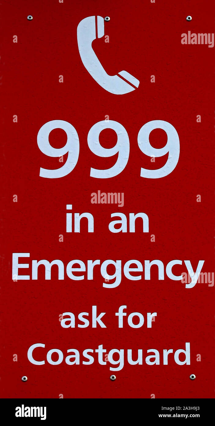 Emergency Coastguard signage on a rainy day Stock Photo - Alamy