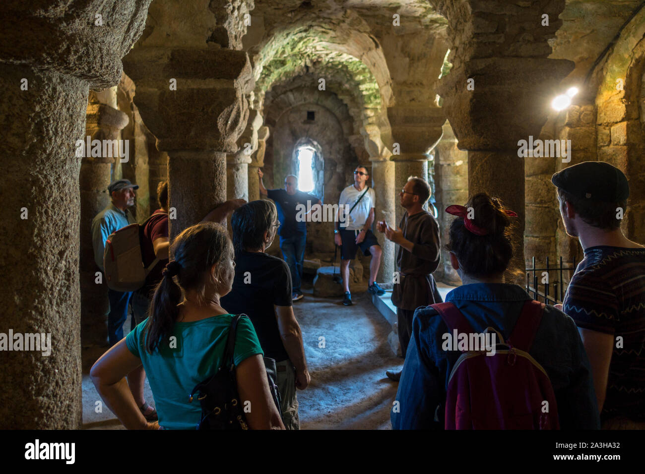 Tourists visiting the 12th century Romanesque crypt under the St ...