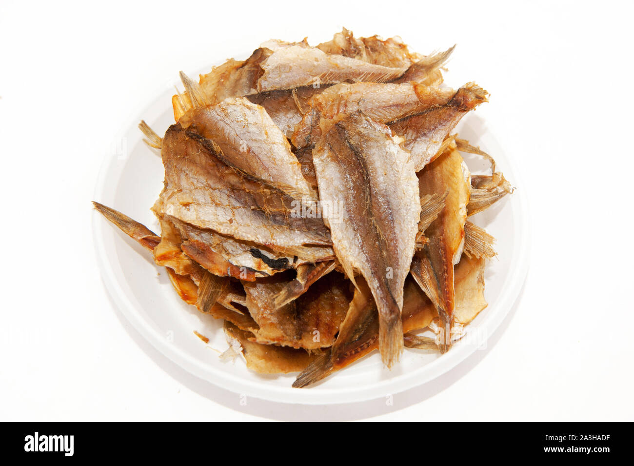 Fish snacks for beer on a plate on a white background Stock Photo - Alamy