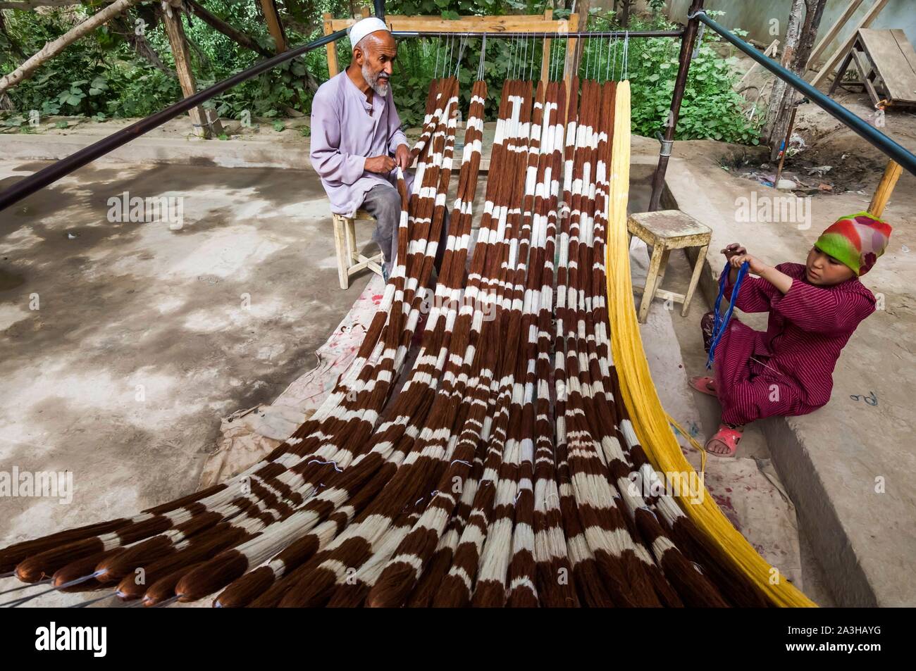 China, Xinjiang autonomous region, Hotan, traditional workshop for silk ...