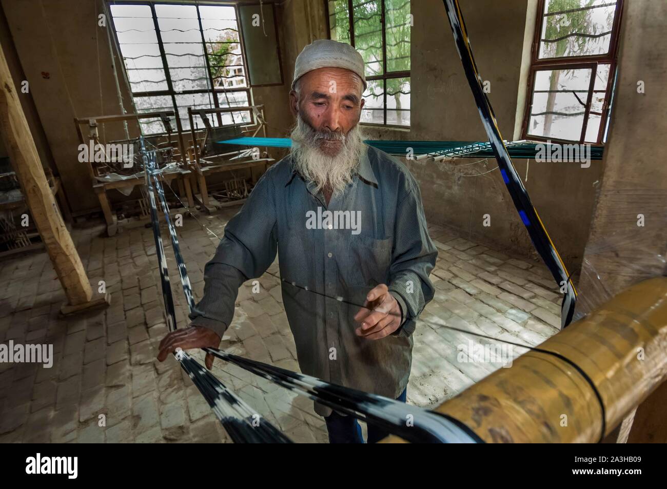 China, Xinjiang autonomous region, Hotan, traditional workshop for silk ...