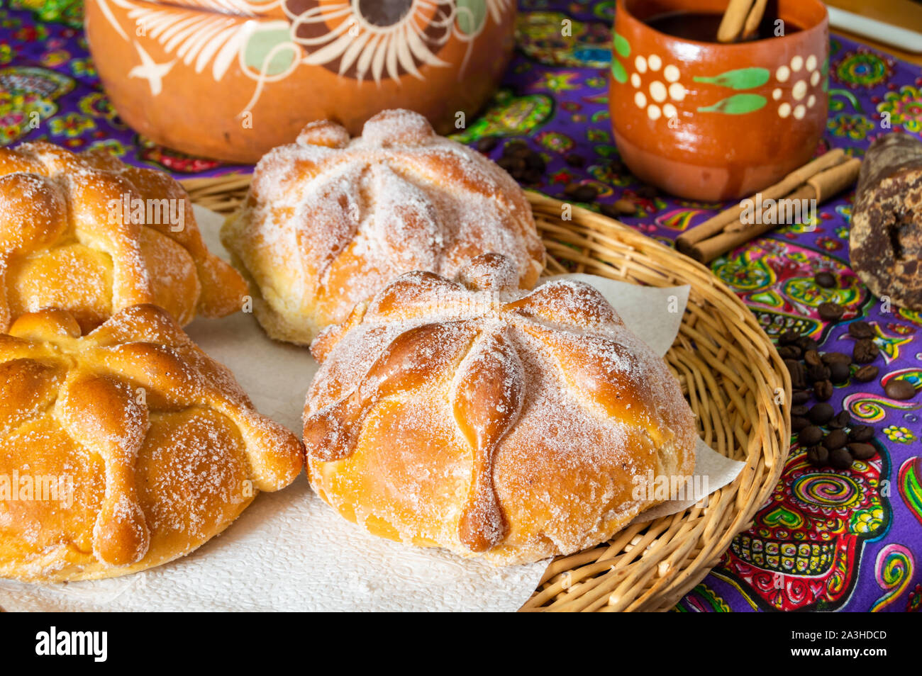 Traditional Mexican bread of the dead (pan de muerto) served with ...