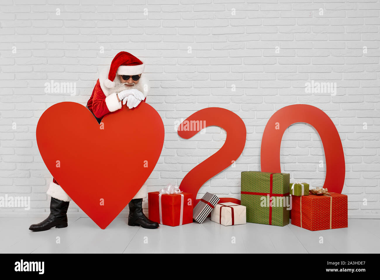 Smiling Saint Nicholas in red costume, white gloves and black ...