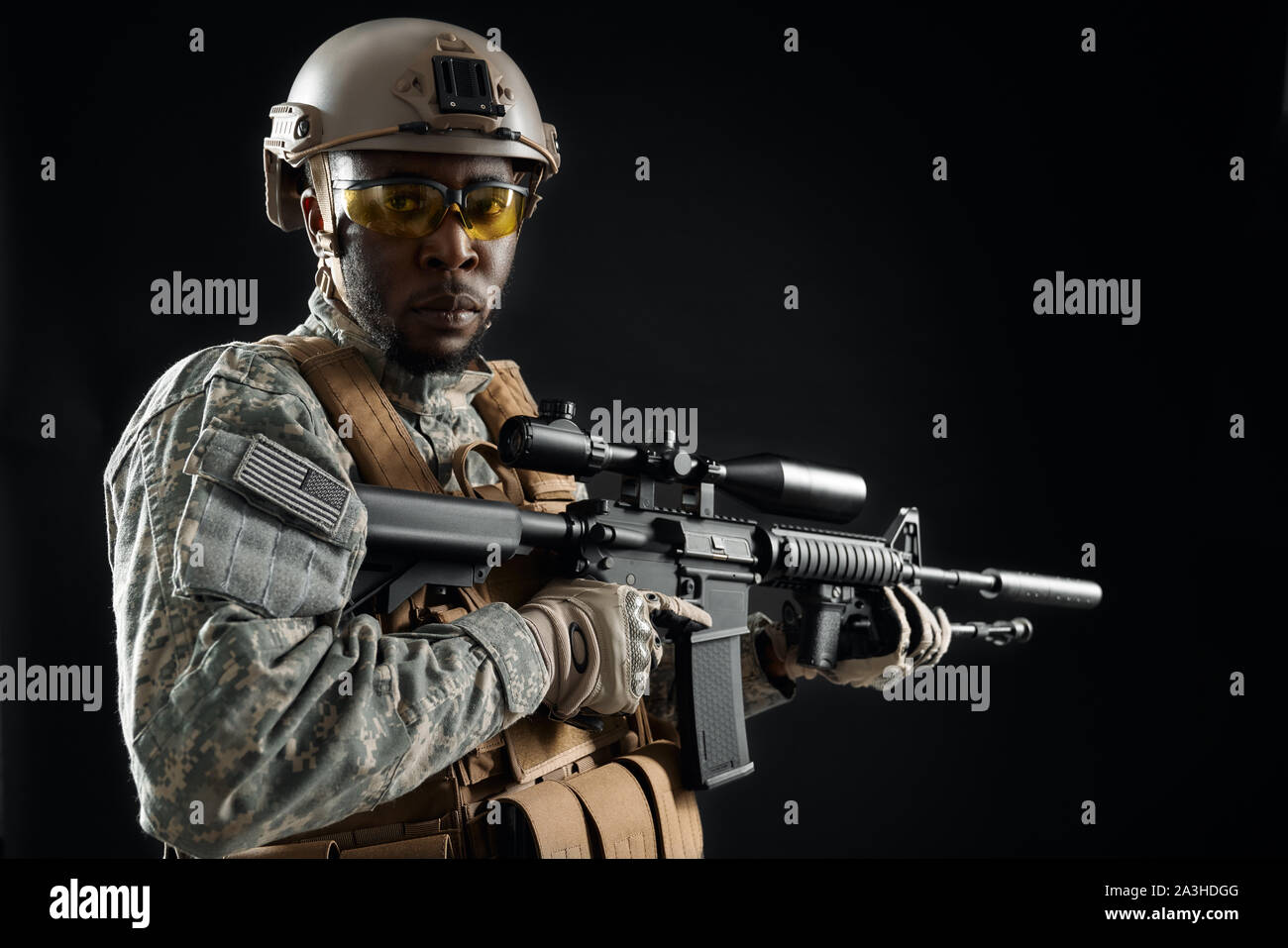 Side view of male soldier wearing Americans army uniform and glasses ...