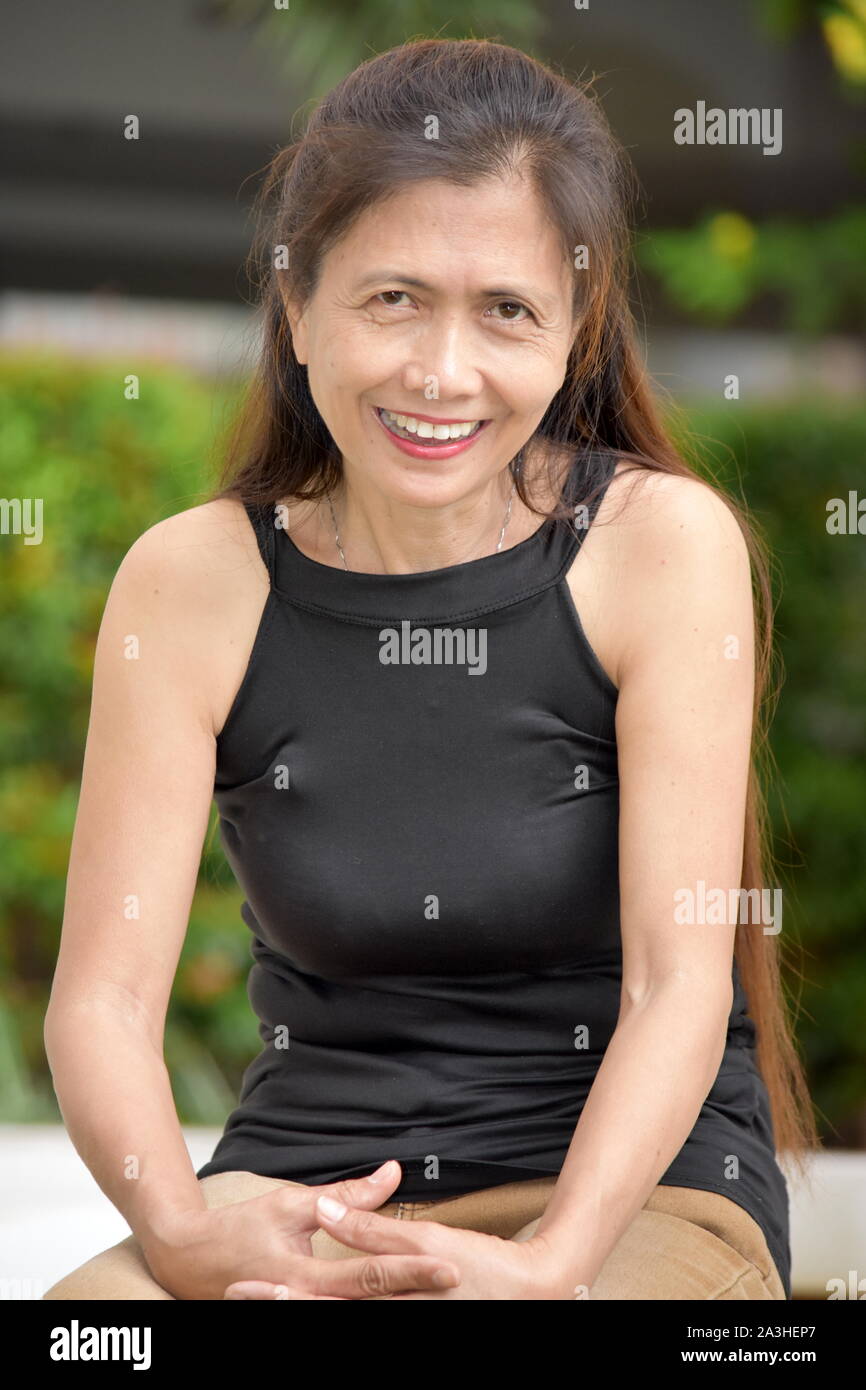 A Filipina Female Senior Smiling Stock Photo - Alamy
