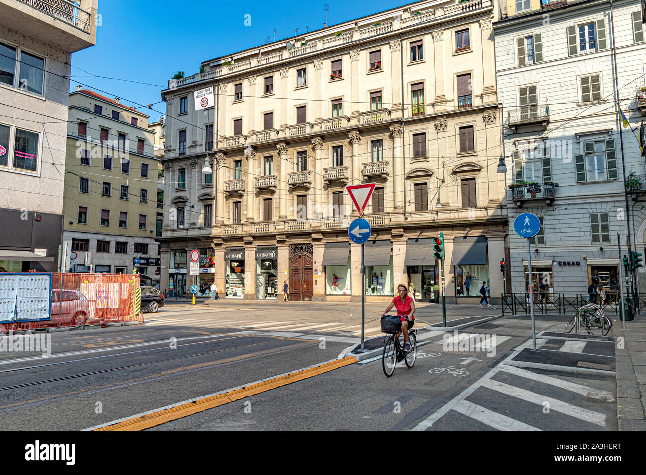A woman riding a bicycle along a cycle lane on Corso Giacomo Matteotti ...