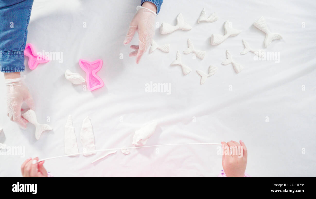 Flat lay. Step by step. Making mermaid tail from modeling clay in ...