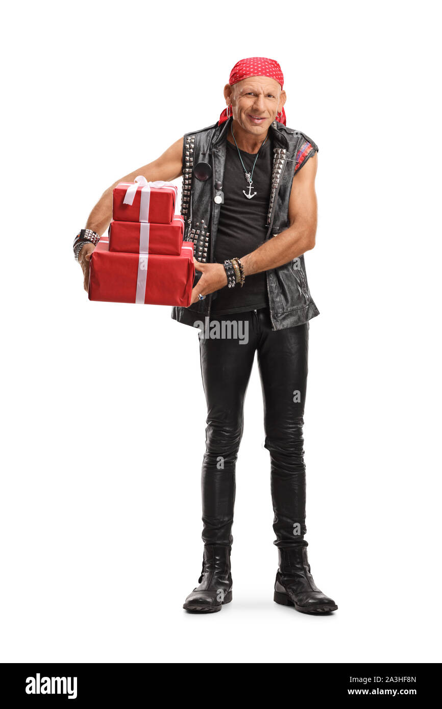 Full length portrait of a punker with a headscarf holding presents ...