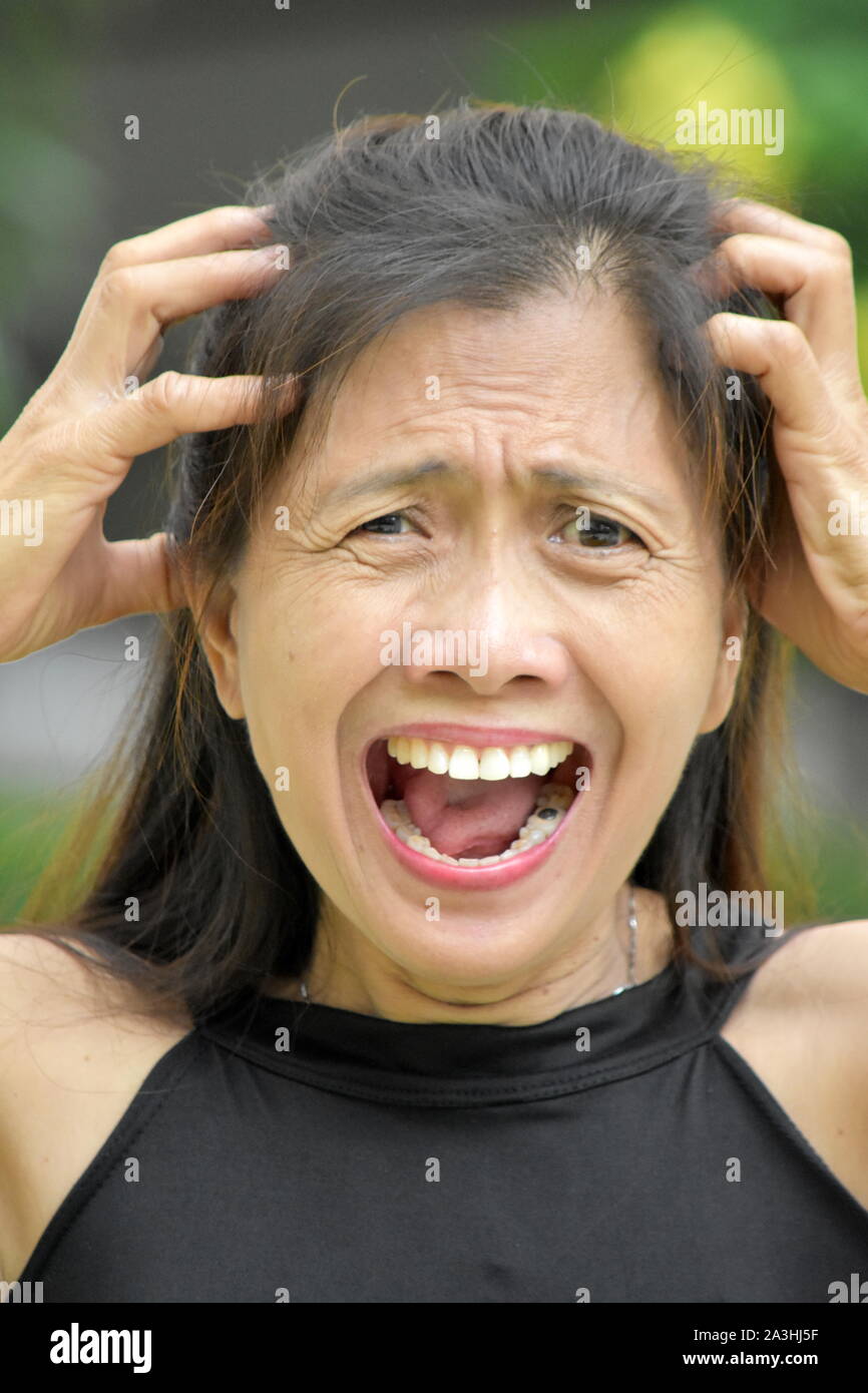 A Stressed Female Senior Stock Photo - Alamy