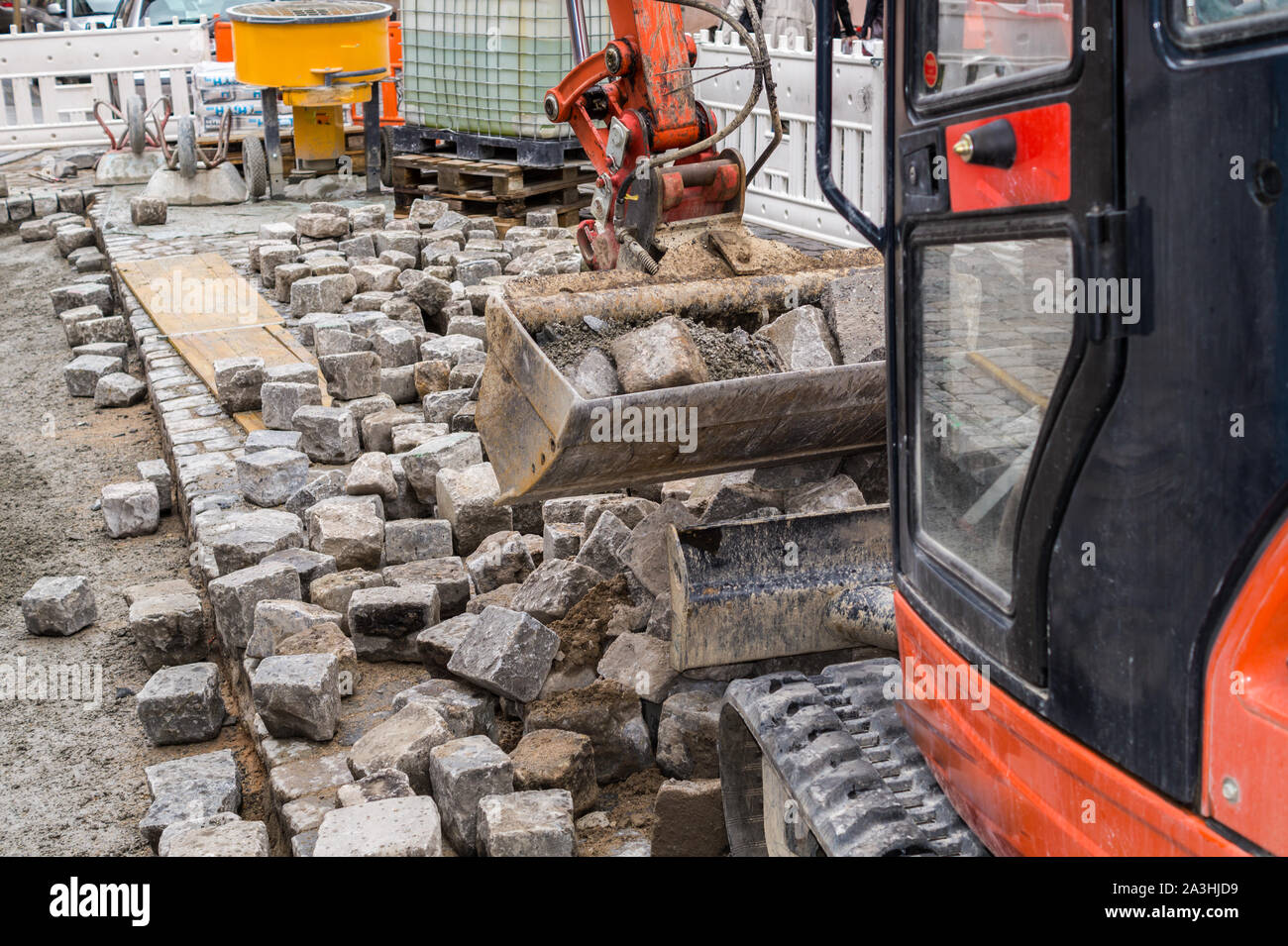 Excavator for road construction Stock Photo - Alamy