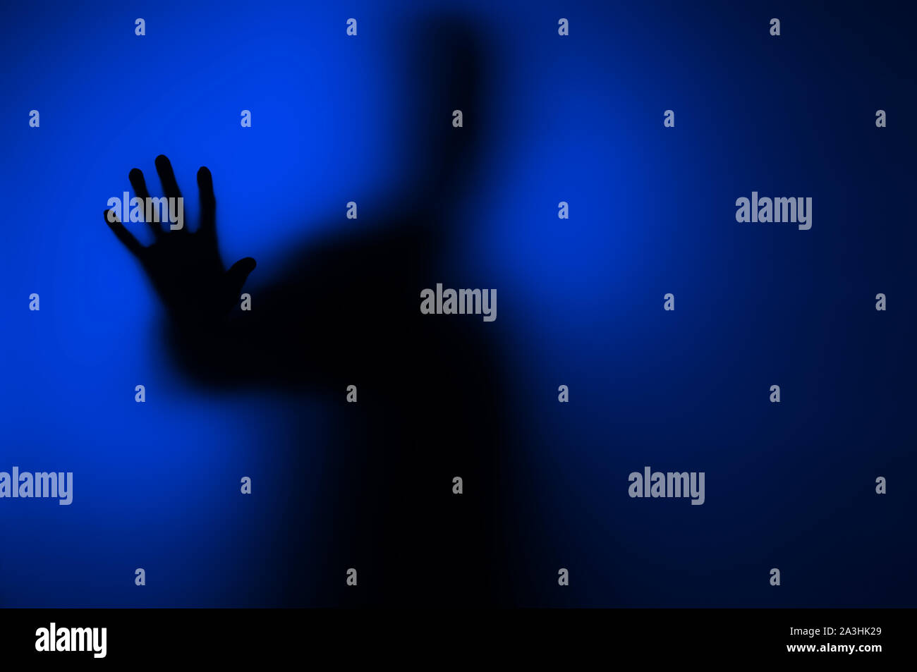 Blue colored version of the Ghosts hand Stock Photo - Alamy