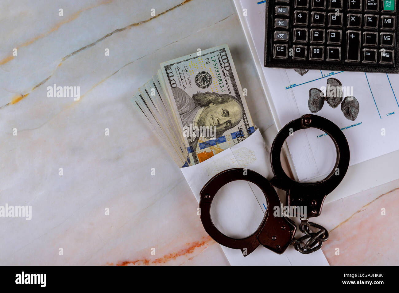Handcuffs on a set of fingerprints file, money american dollars ...