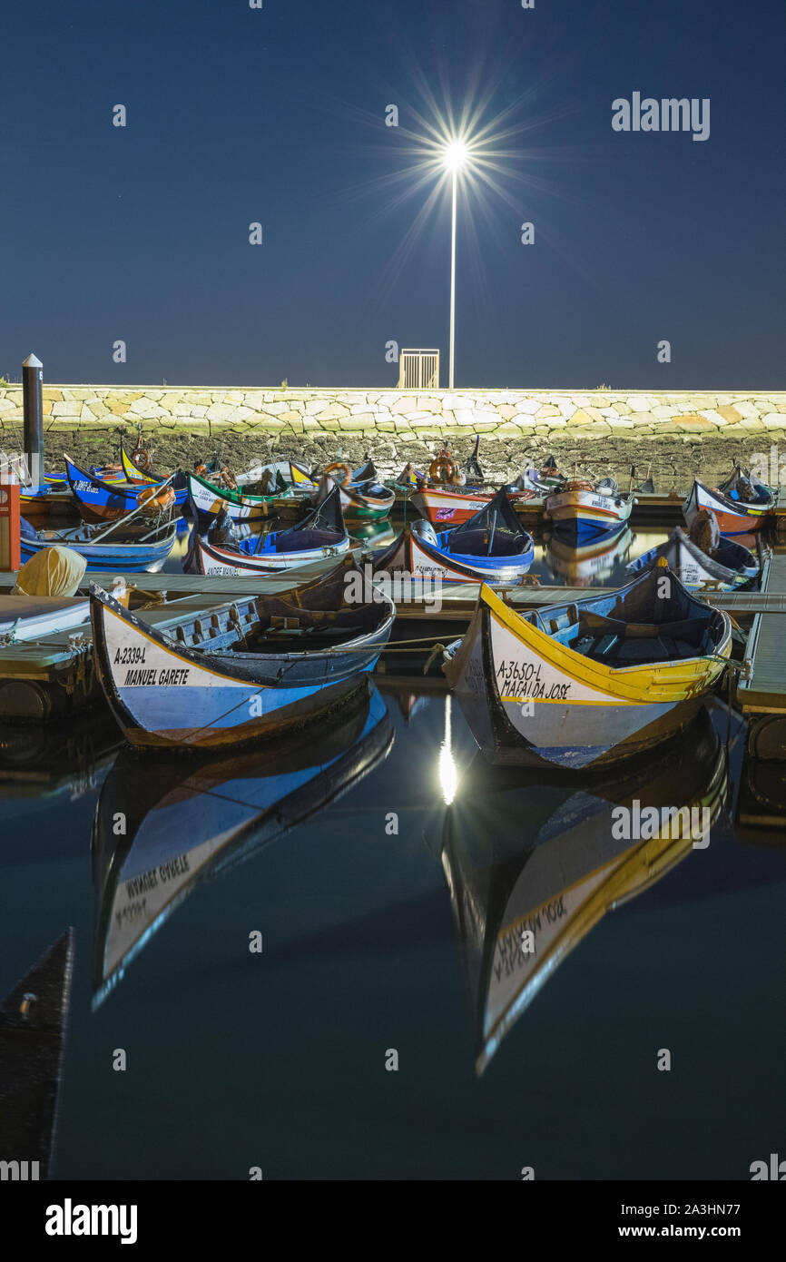 wooden boats reflected in Aveiro`s port Stock Photo - Alamy