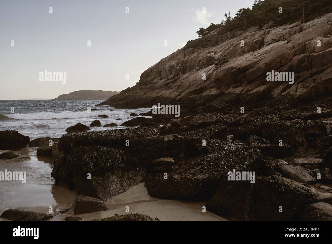 Sunset over rugged coastline of Sand Beach on a cool Fall evening in ...