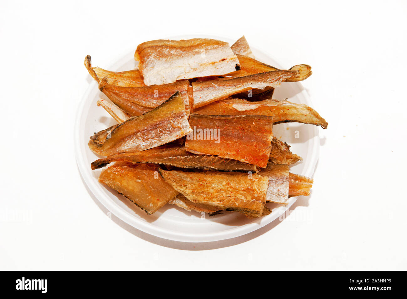 Fish snacks for beer on a plate on a white background Stock Photo - Alamy