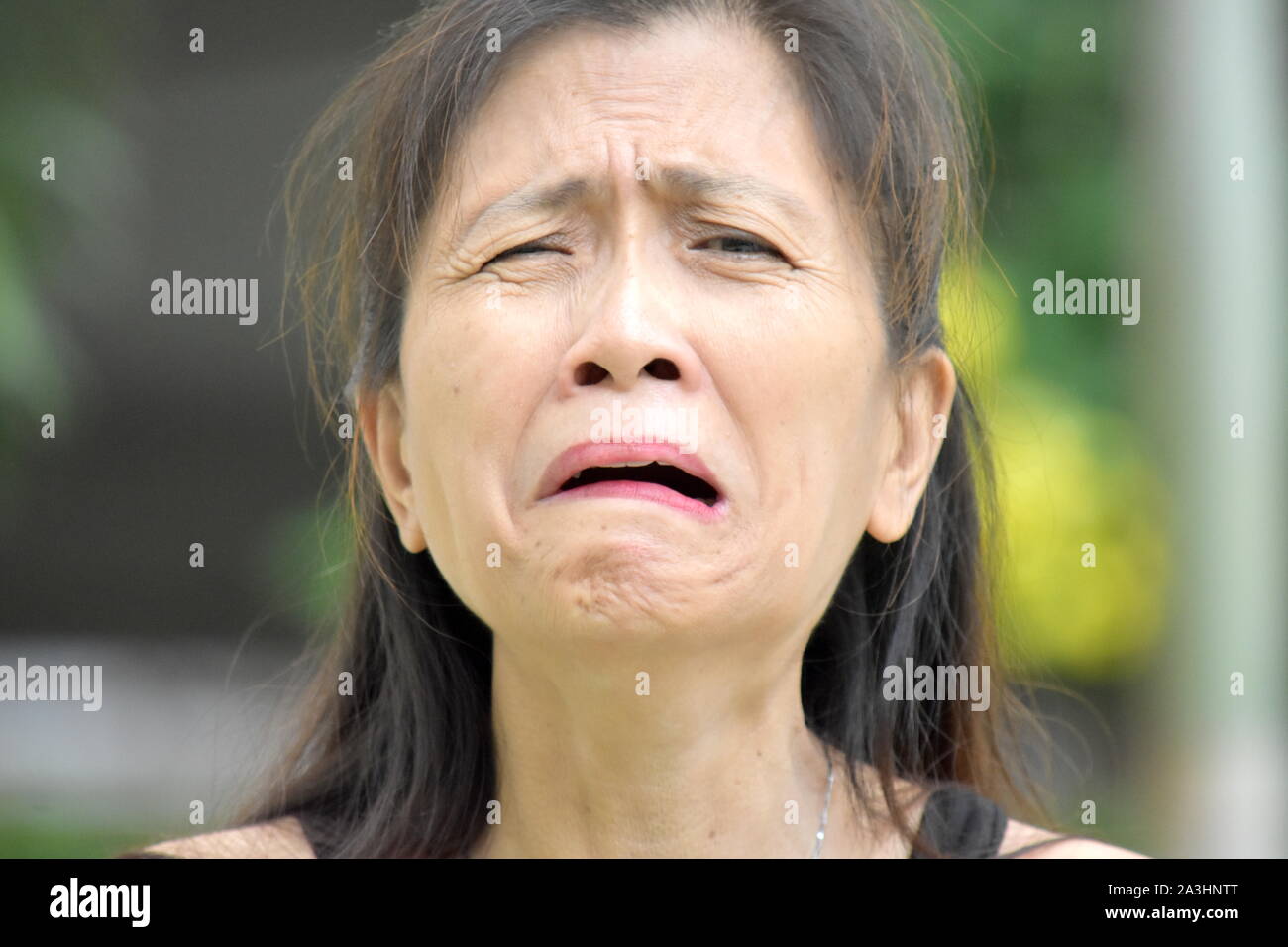 A Crying Diverse Female Senior Stock Photo - Alamy