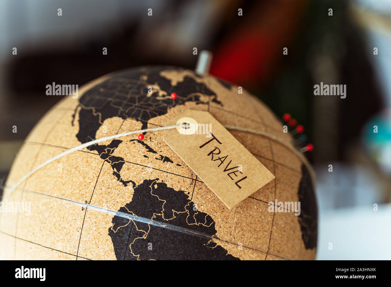 Travel message on a world globe Stock Photo - Alamy