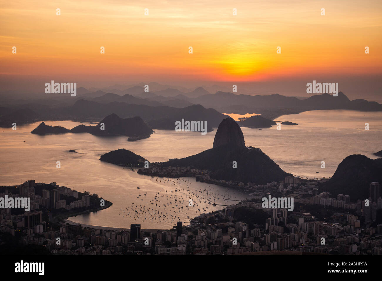Beautiful sunrise view from Corcovado Mountain to the Sugar Loaf, city ...