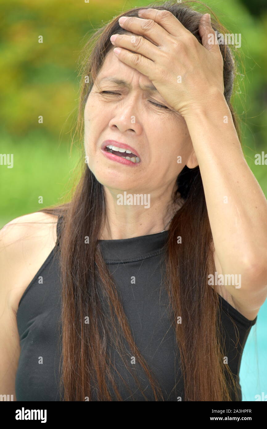 A Forgetful Asian Woman Stock Photo - Alamy
