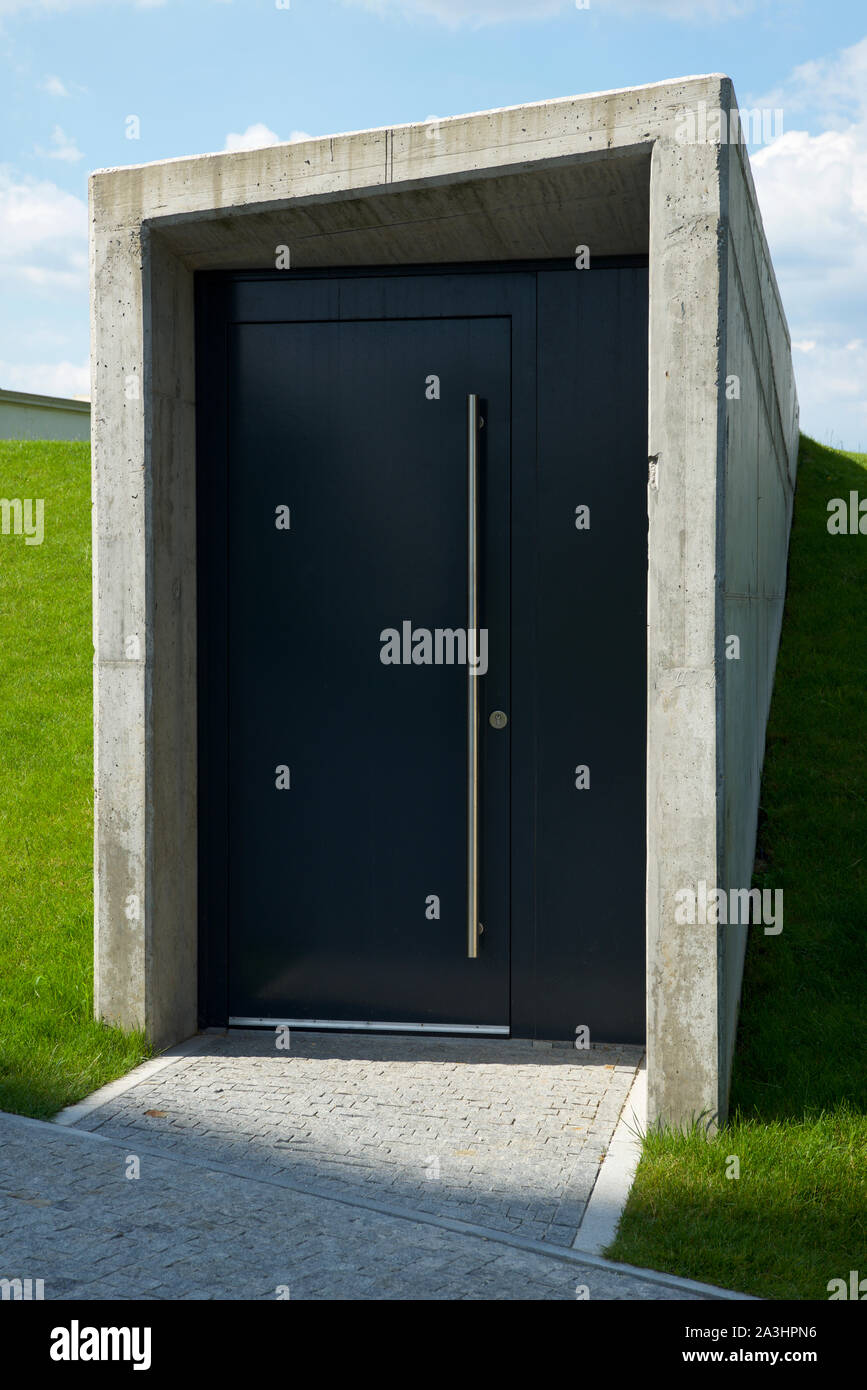 Entrance door to an underground installation Stock Photo - Alamy