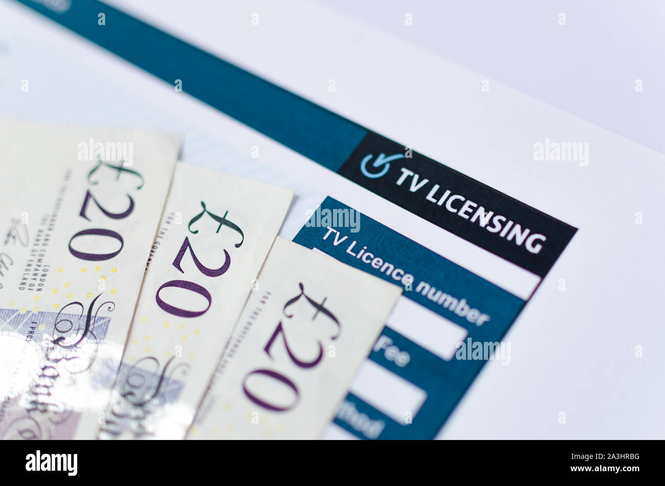 Close up photo of UK TV license with 20 pound notes. TV Licensing for ...