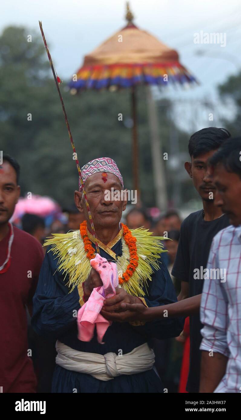A devotee dressed up as deity carrying sword participates in Khadga ...