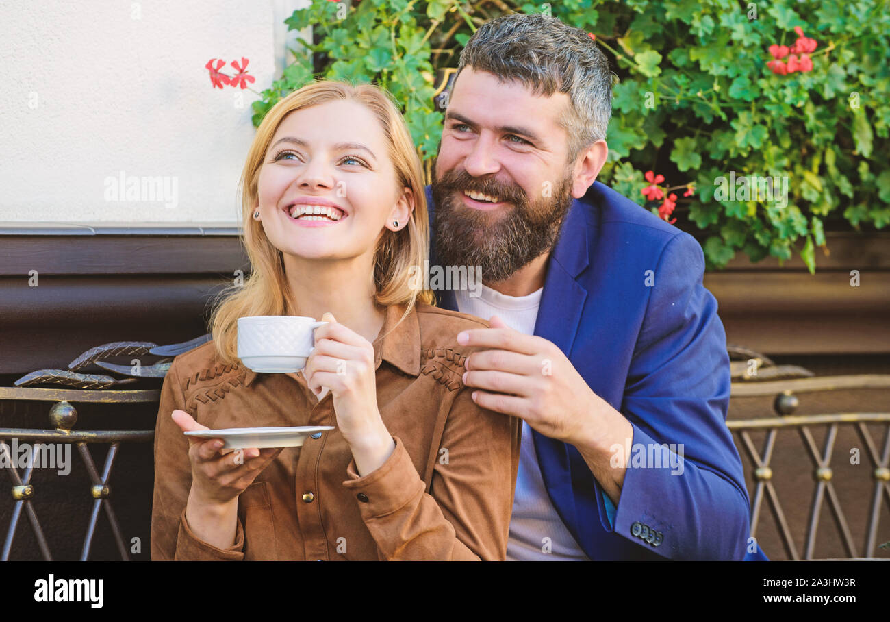 Couple cuddling cafe terrace. Couple in love sit hug cafe terrace enjoy ...