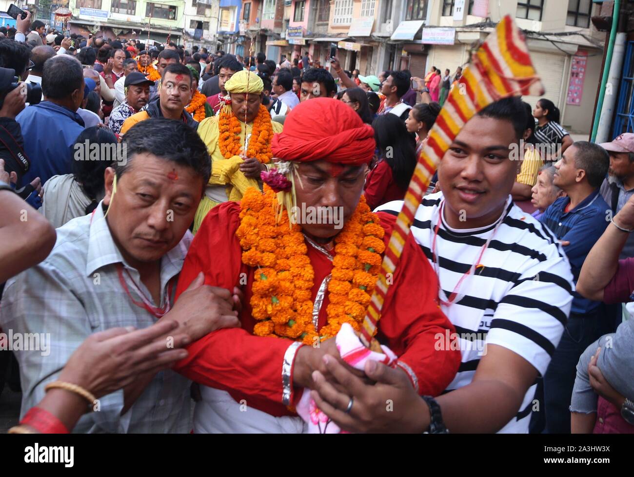Devotees dressed up as deities carrying sword participate in Khadga ...