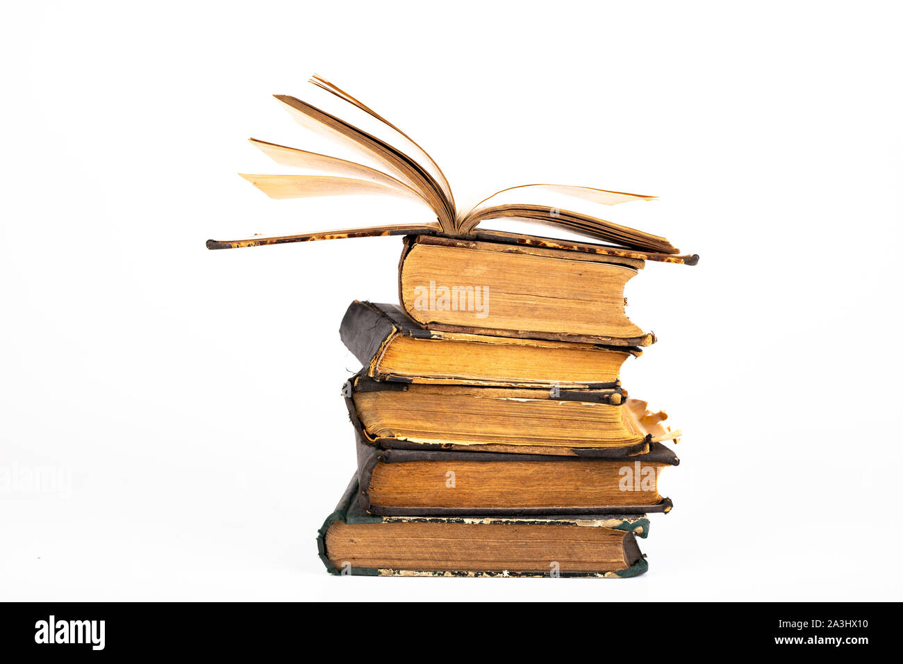 Old dusty books on a light countertop. Library items in old bindings ...