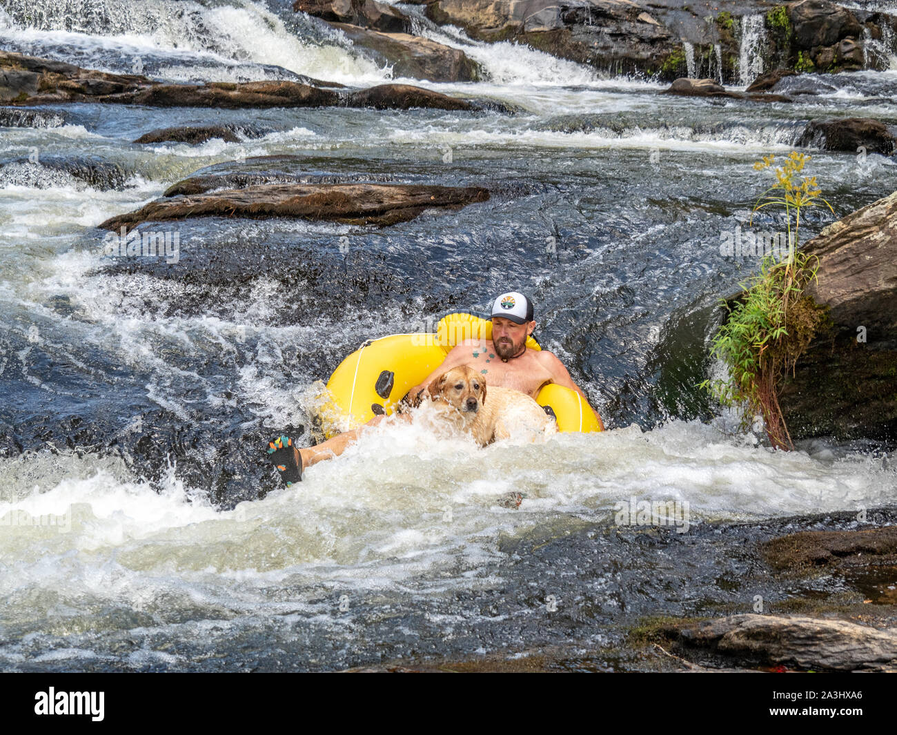 Man floating in an inner tube hi-res stock photography and images - Alamy