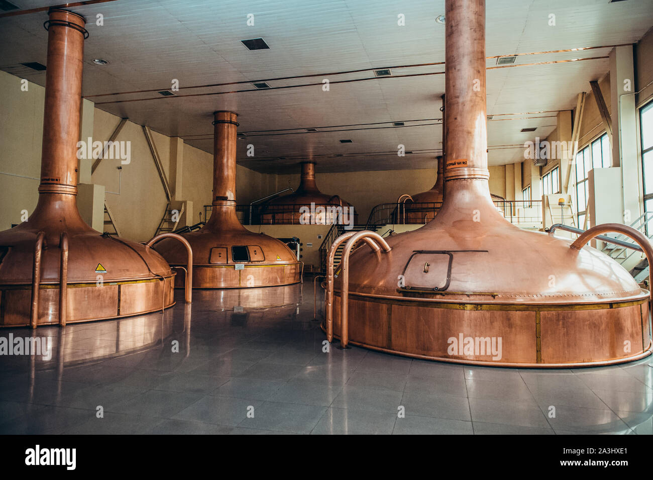 Brewing production - mash vats. Modern brewery factory interior. Steel ...
