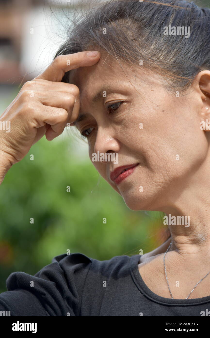 Old Asian Female Senior Decision Making Stock Photo - Alamy