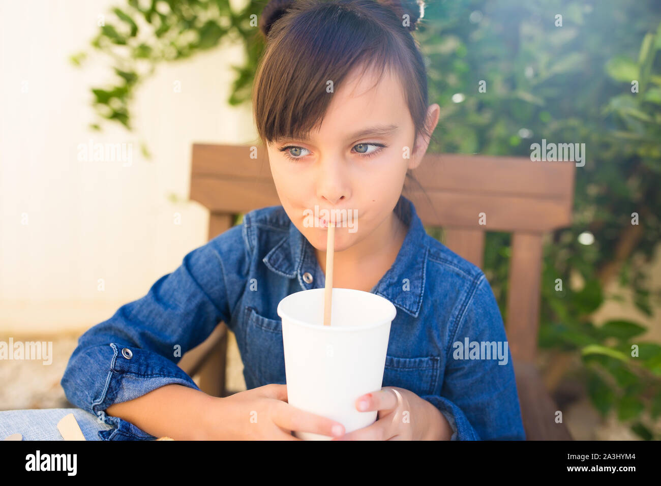 Healthy girl using paper straw Stock Photo - Alamy