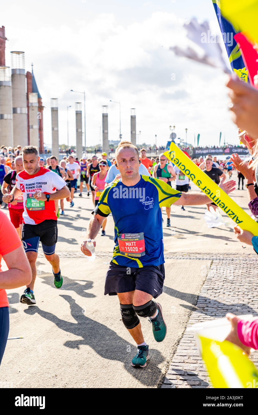 Cardiff Half Marathon: Runners and crowds raise money for charity ...