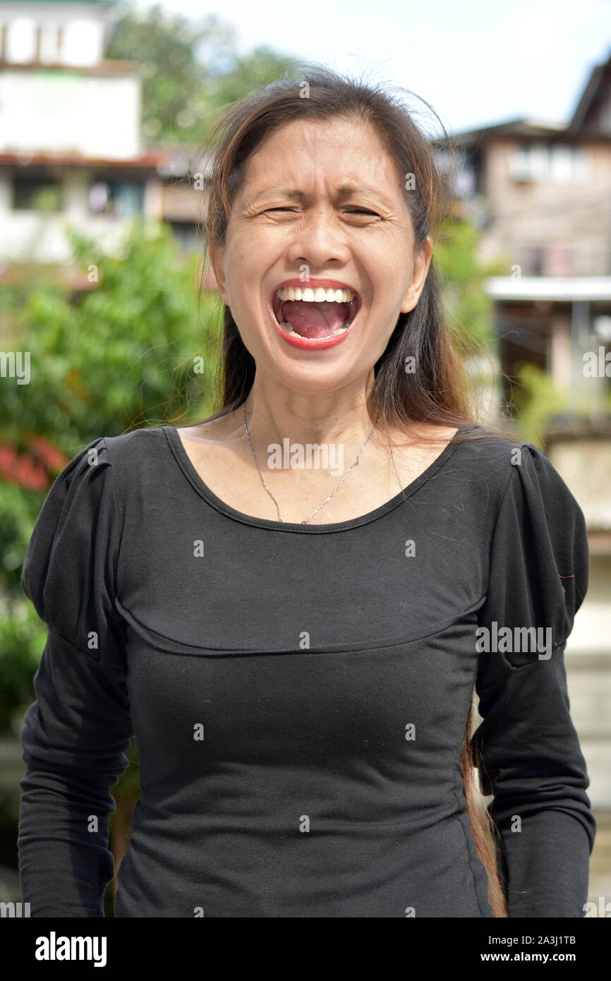 A Filipina Female Senior Shouting Stock Photo - Alamy