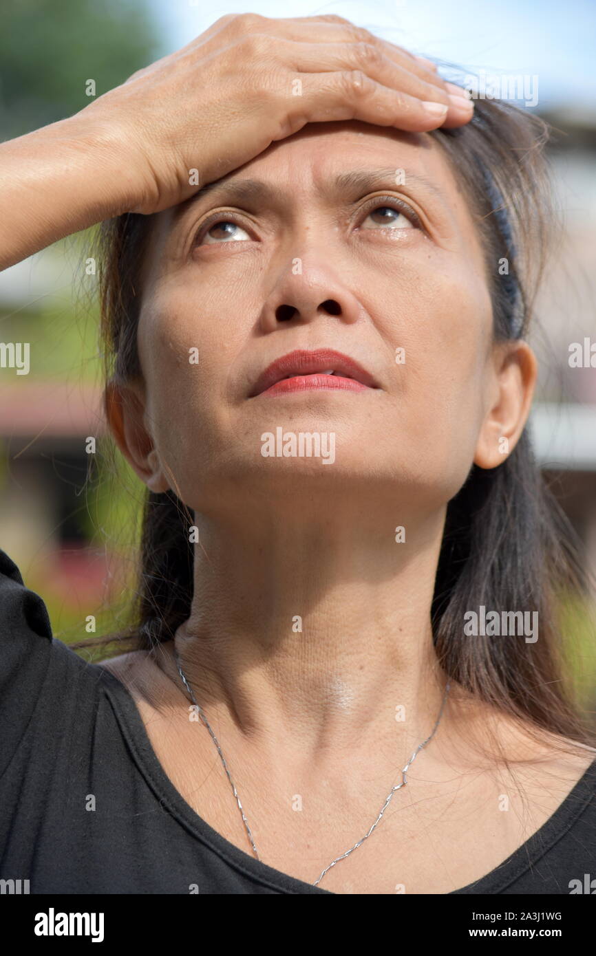 A Forgetful Female Senior Stock Photo - Alamy