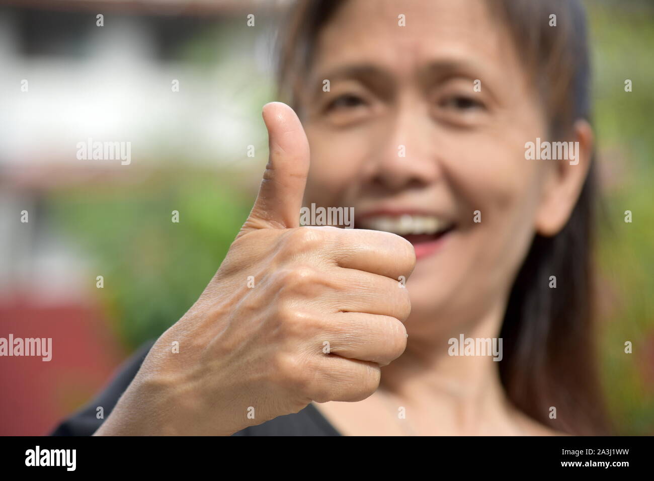 A Happy Minority Adult Female Stock Photo - Alamy
