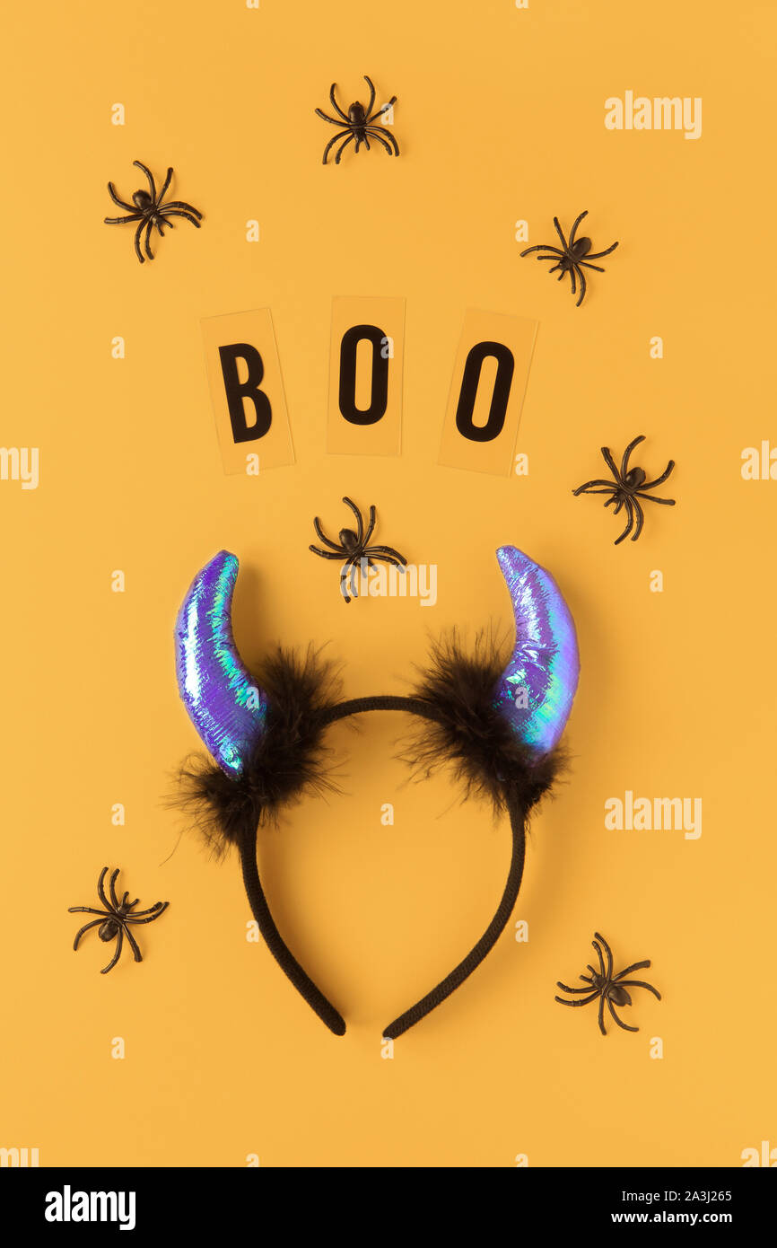 Halloween holiday flat lay. Party accessory, rim with devil horns ...