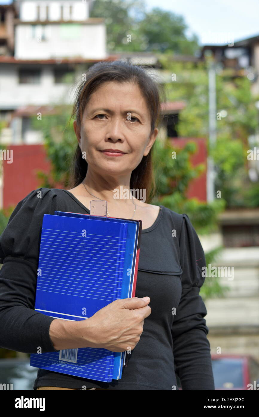 An Unemotional Filipina Female Teacher Stock Photo - Alamy