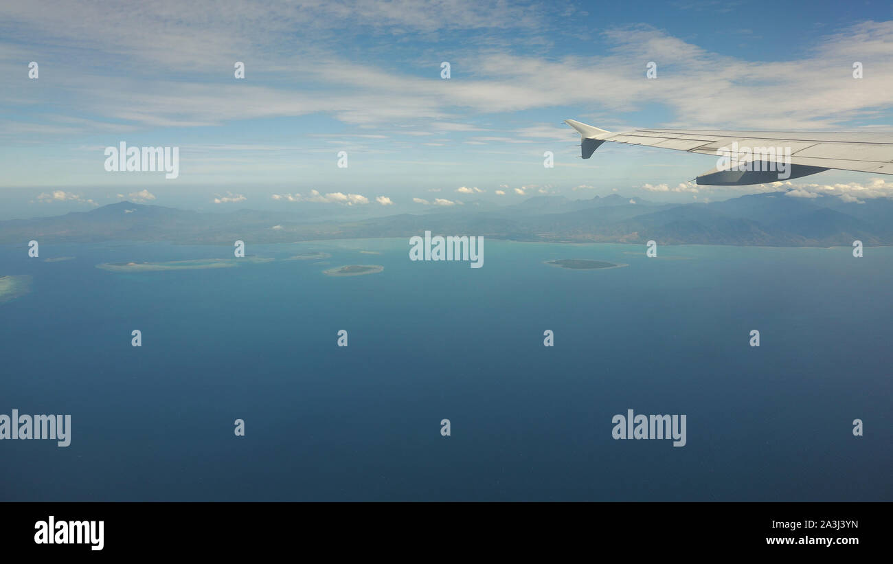 Blue sea or ocean in it and small tropical islands. Looking through ...