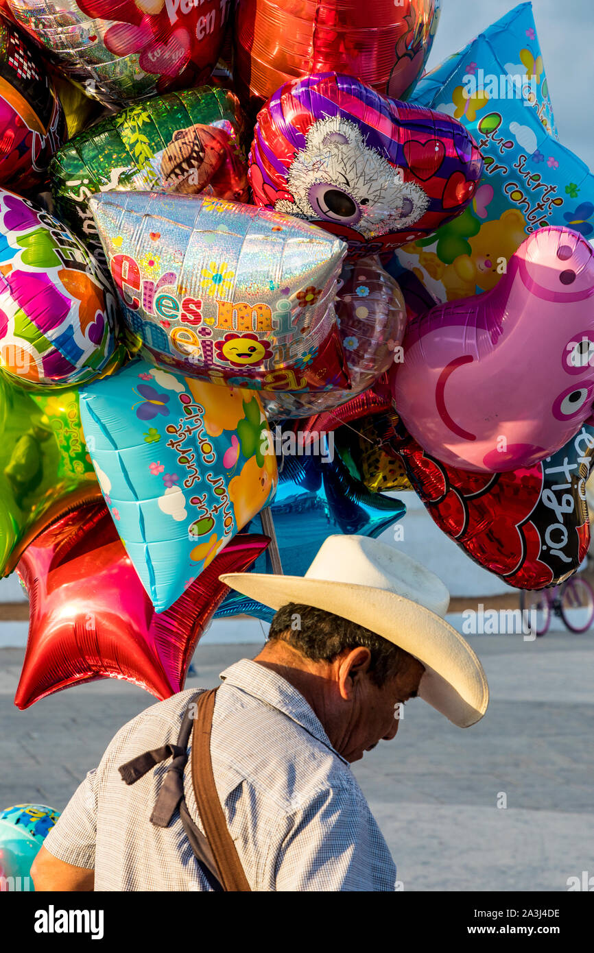 A Mexican vendor sells brightly colored balloons in the Loreto town ...