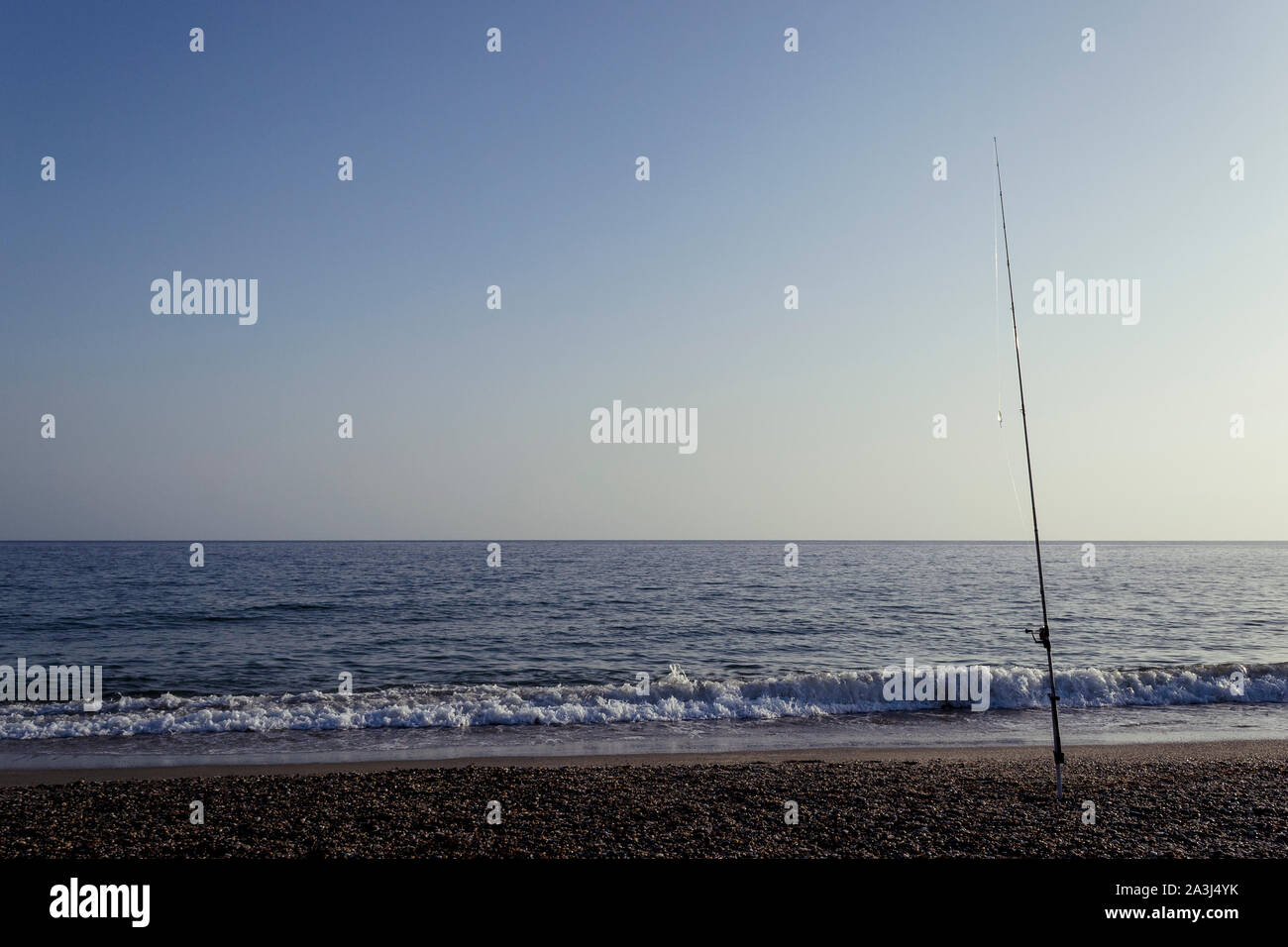 Fishing on the beach, fishing rod in the sand on the beach Stock Photo ...