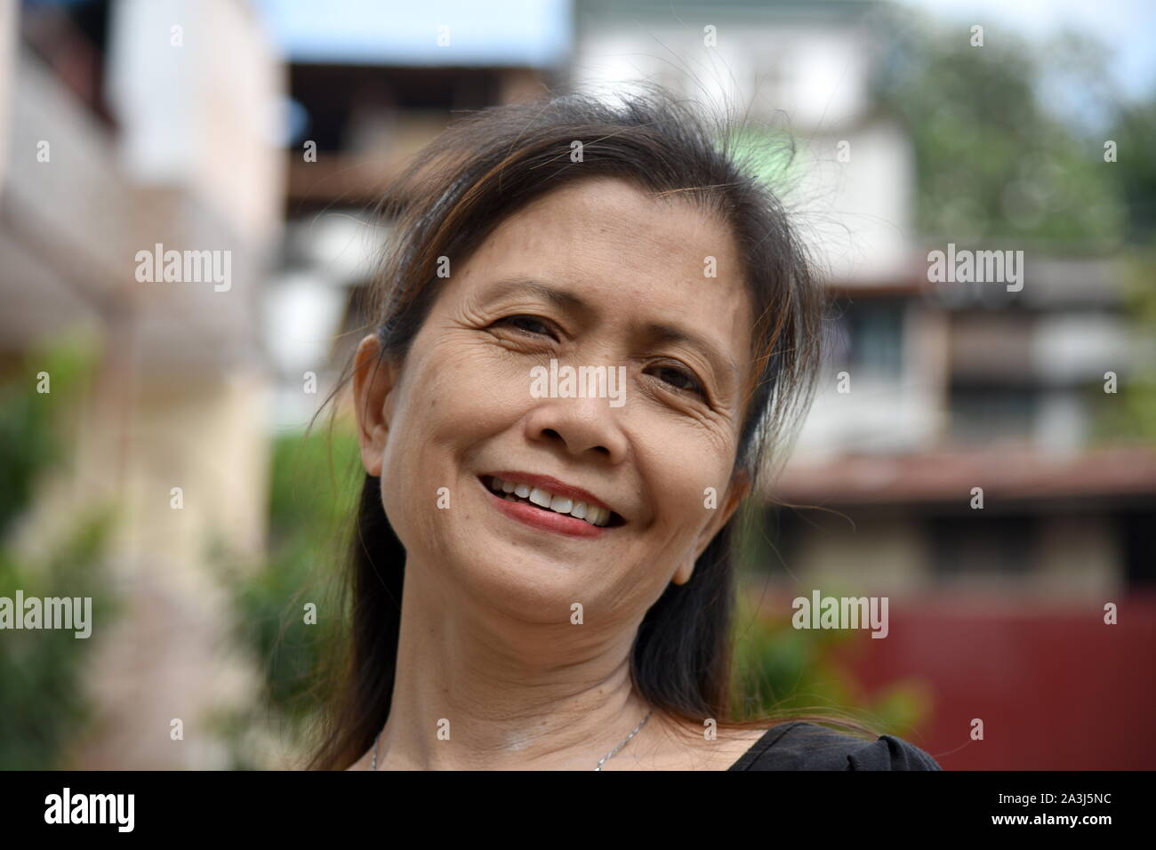 Female senior citizen smiling hi-res stock photography and images - Alamy