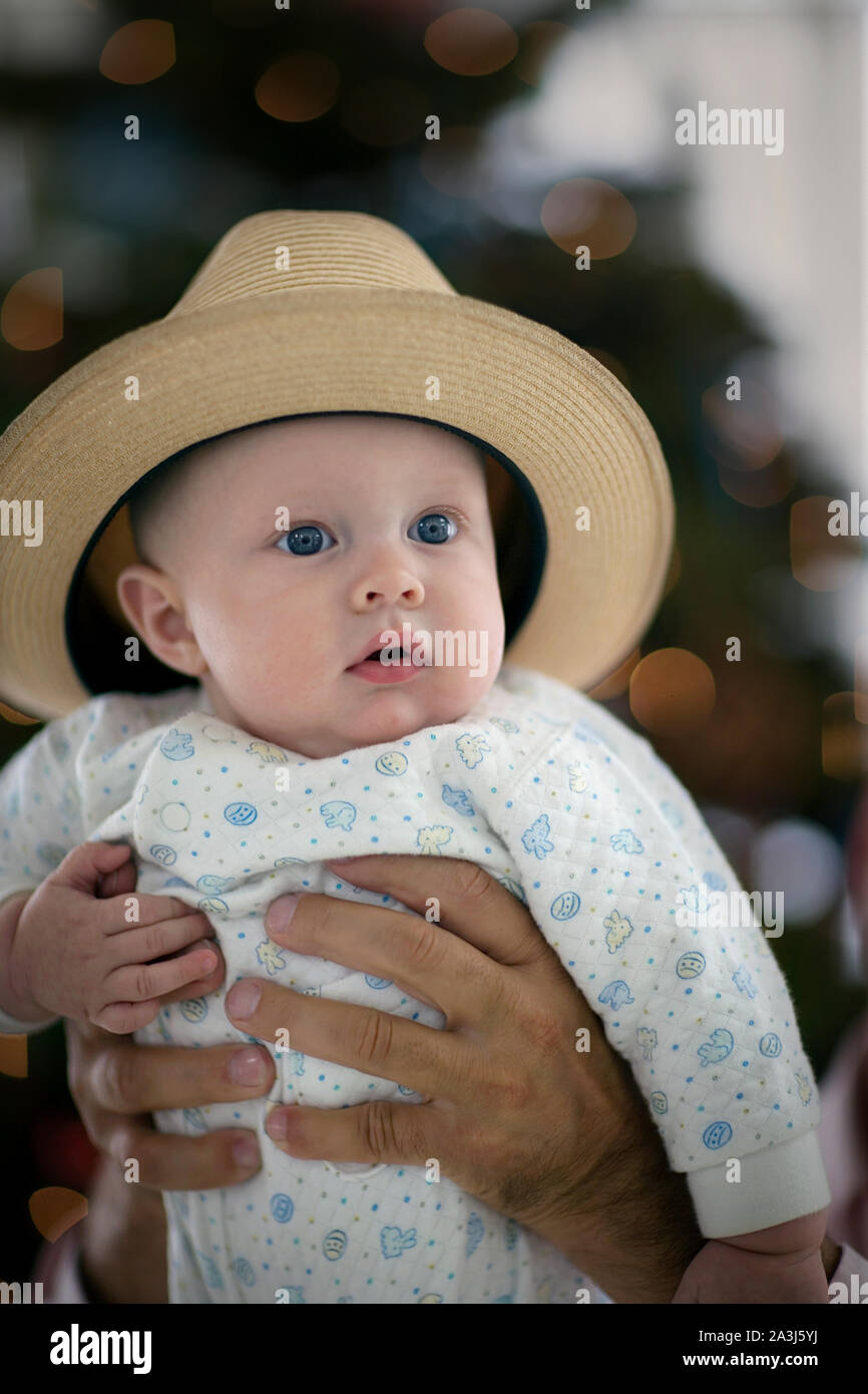 Young baby wearing a large hat Stock Photo - Alamy