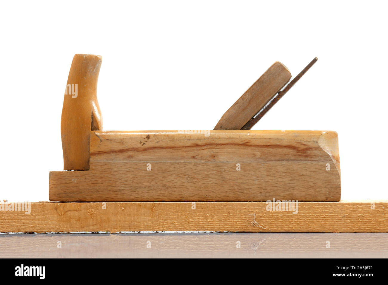 Old wooden hand planer or Carpenter Tool on wood plank isolated white ...