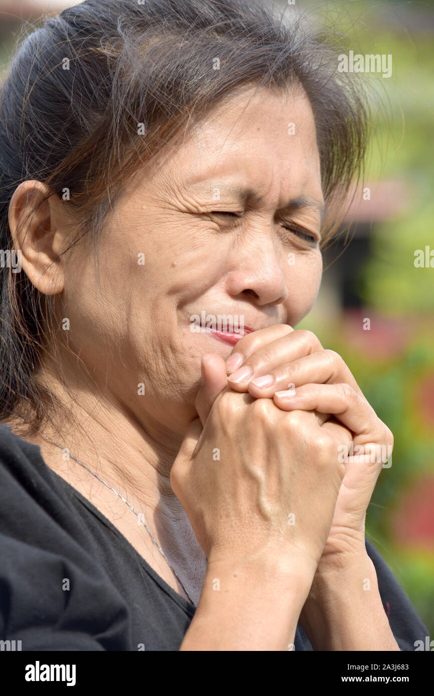 A Crying Filipina Female Senior Stock Photo - Alamy