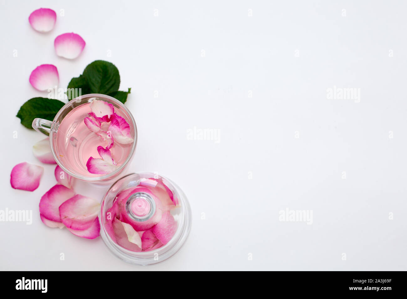 Rose petals tea in a white background. Horizontal Stock Photo - Alamy