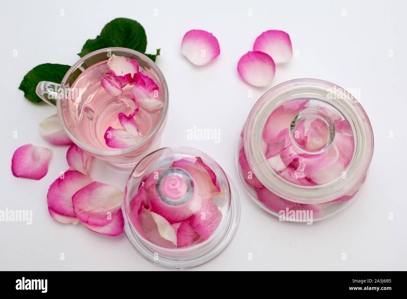 Rose petals tea in a white background. Horizontal Stock Photo - Alamy
