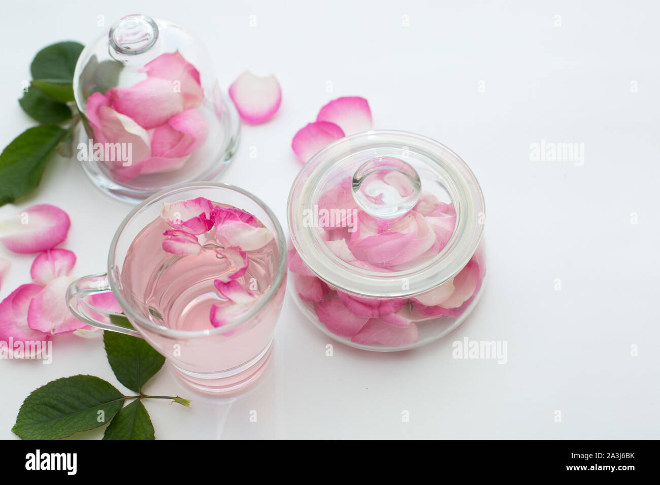 Rose petals tea in a white background. Horizontal Stock Photo - Alamy