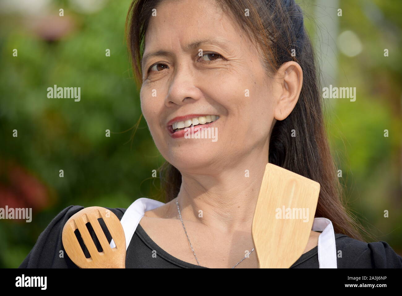 Female apron hi-res stock photography and images - Alamy